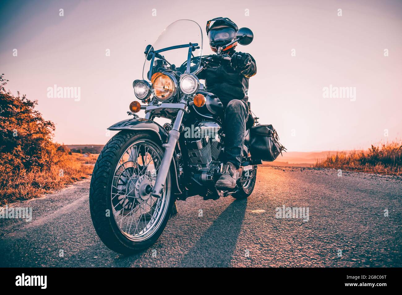 Motorcycle driver riding on countryside. Travel and sport, speed and ...
