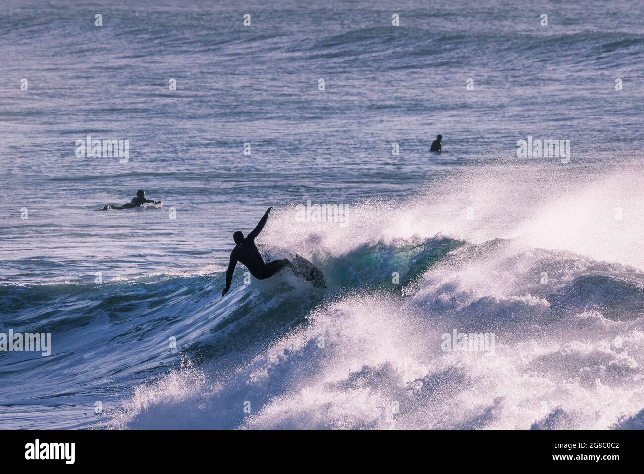 Surfing action in Fistral Bay in Newquay in Cornwall Stock Photo - Alamy