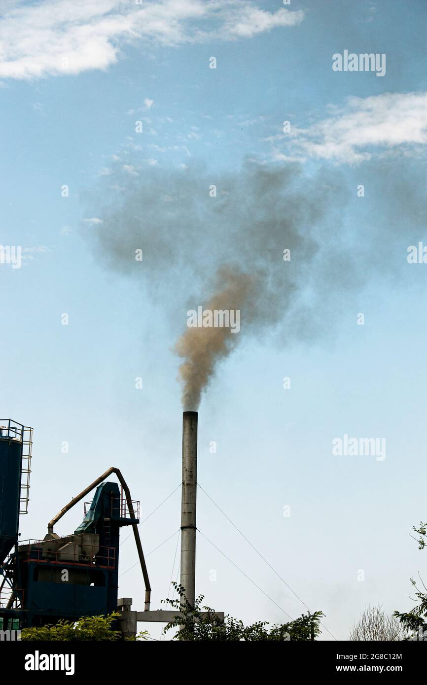 Smoke from chemical factory chimney on cloudy sky background. Ecology ...