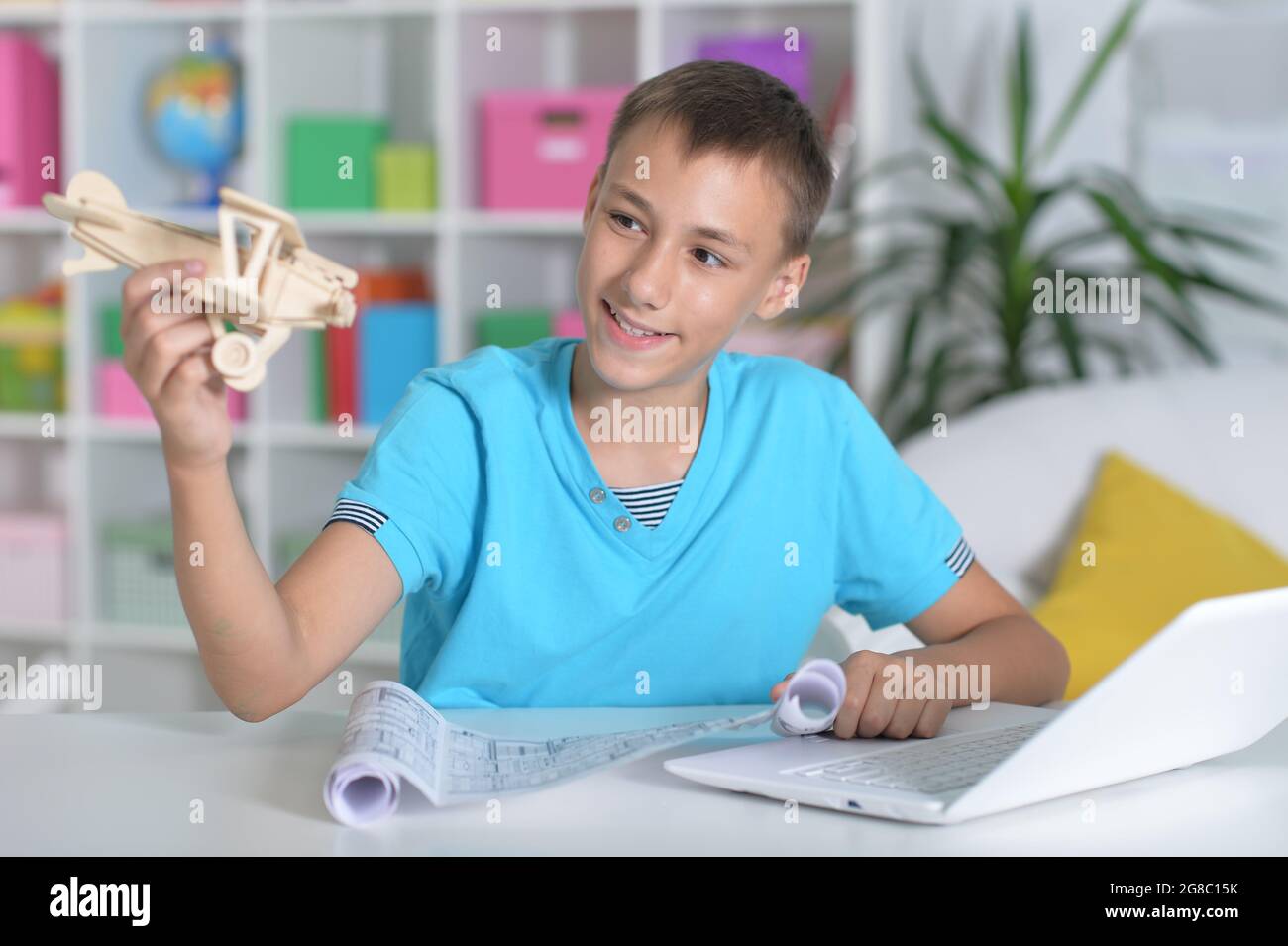 Portrait of a boy with a homemade toy-plane Stock Photo - Alamy
