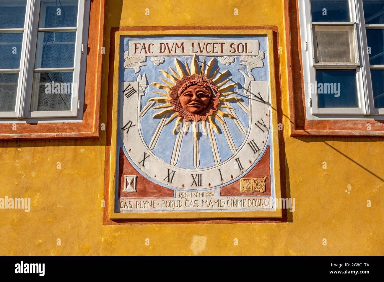 Vintage sundial with latin inscription (fac dum lucet sol) on the ...