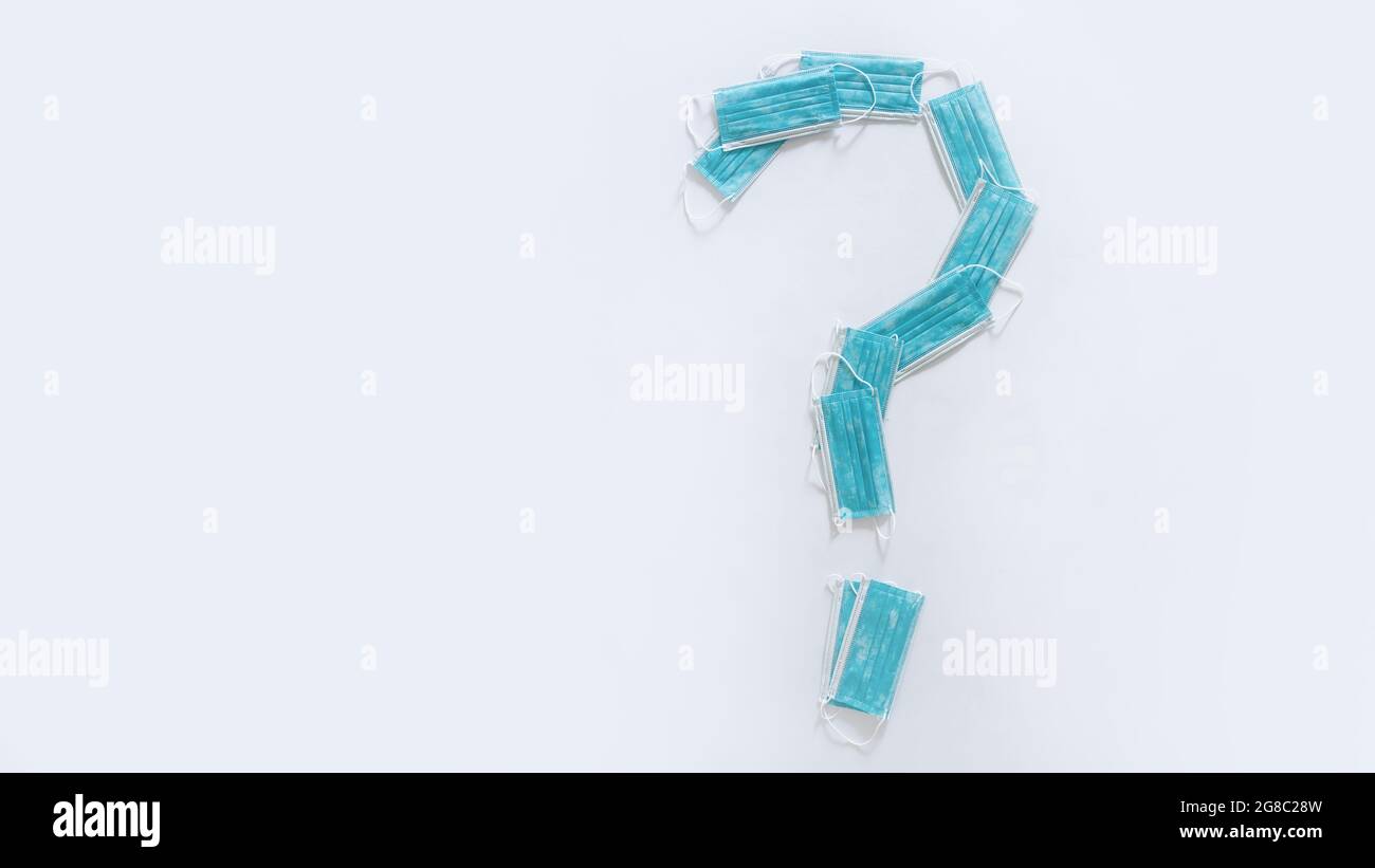 Blue question mark made up of Covid masks isolated on a white ...