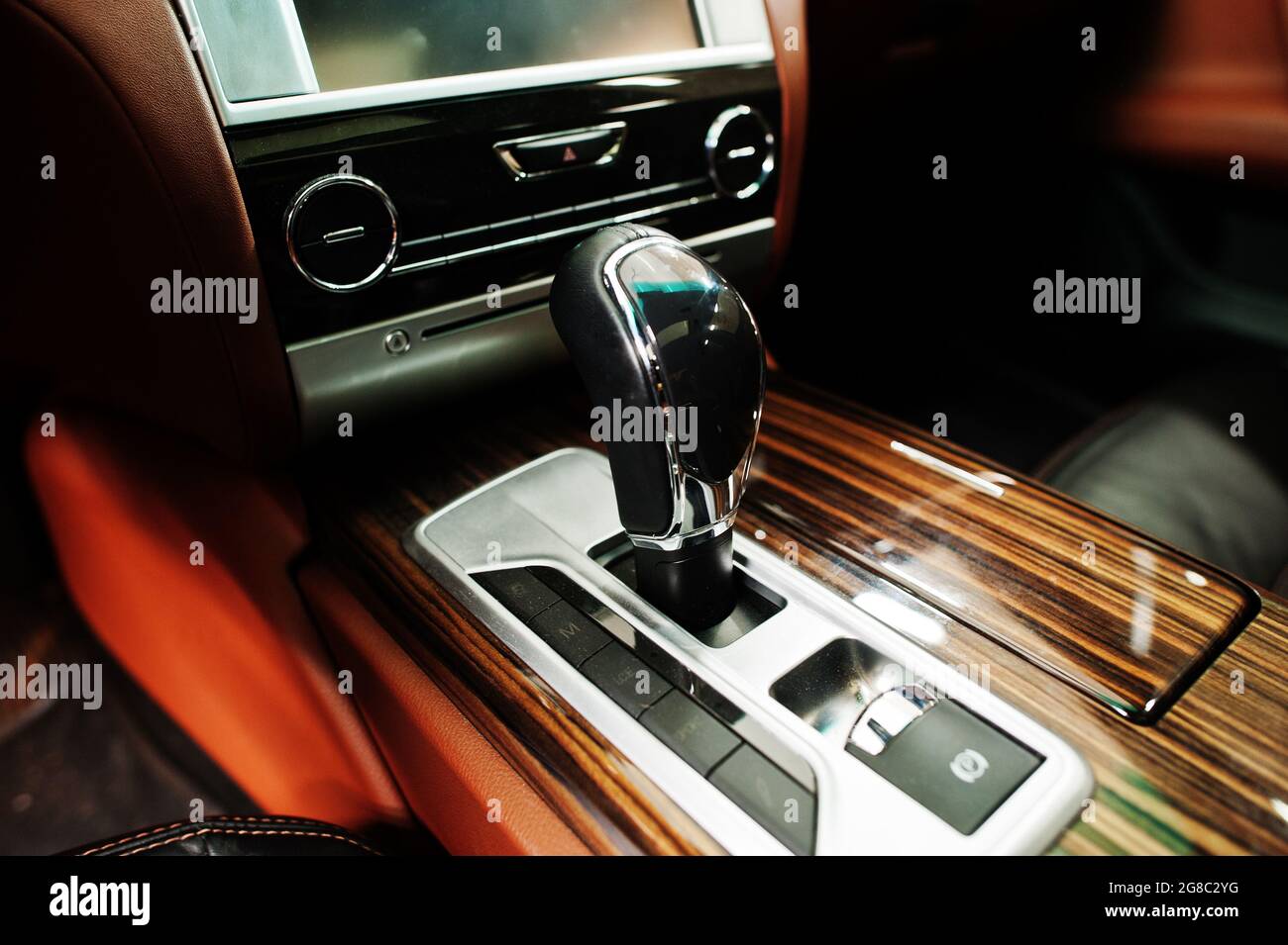 Automatic gear stick of a modern car. Modern car interior details ...