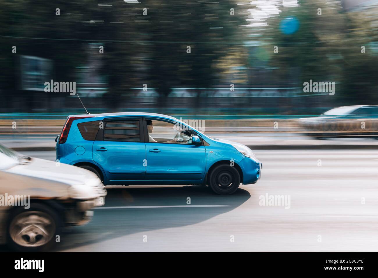 Ukraine, Kyiv - 16 July 2021: Light Blue Nissan Note car moving on the ...