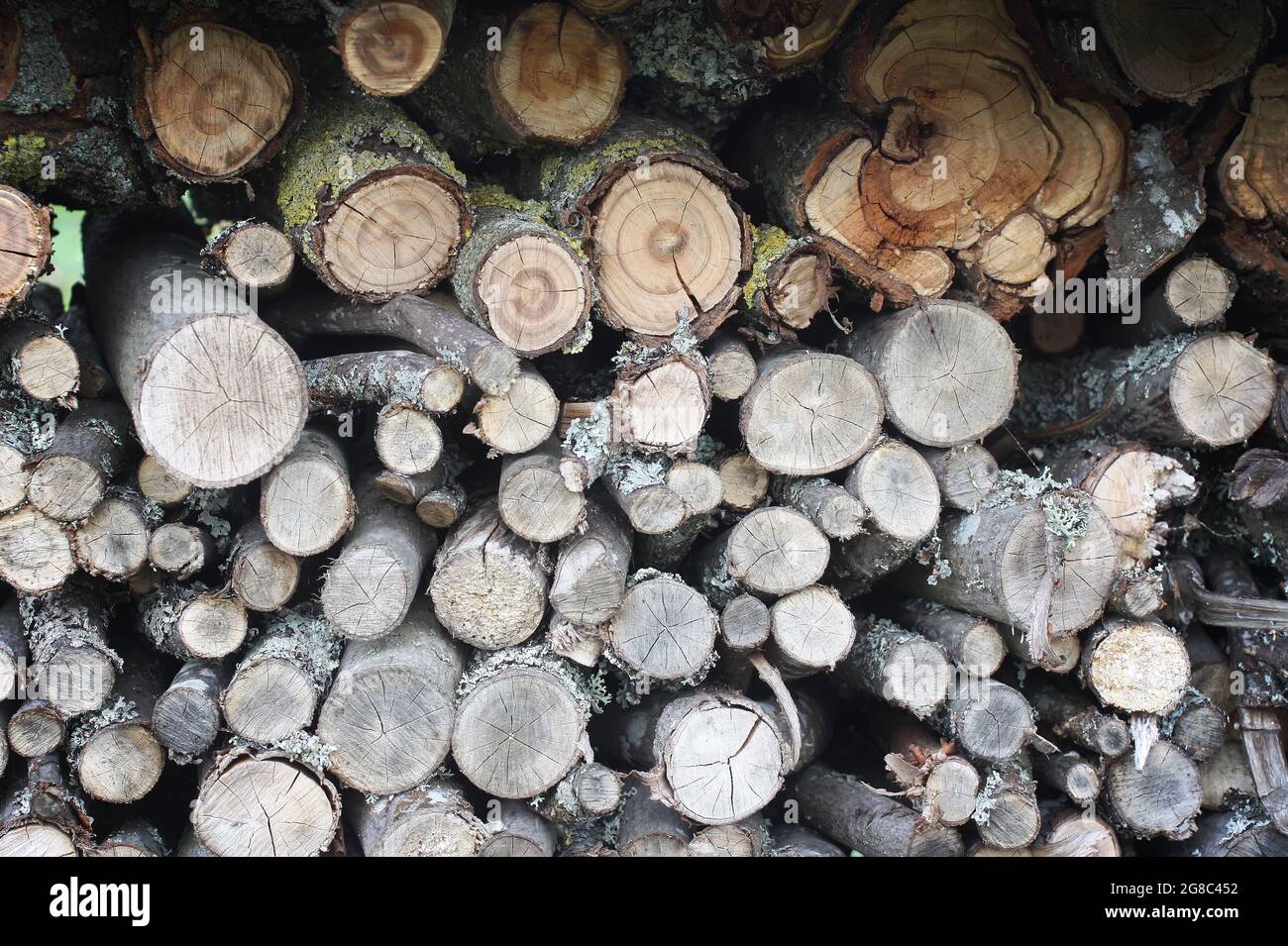 Firewood background - chopped firewood on a stack Stock Photo - Alamy