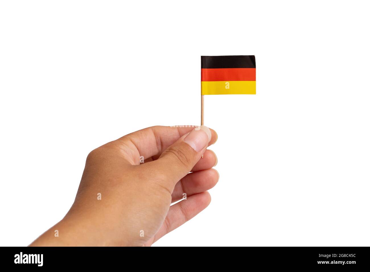 Small germany flag in hand isolated on white background close up Stock ...