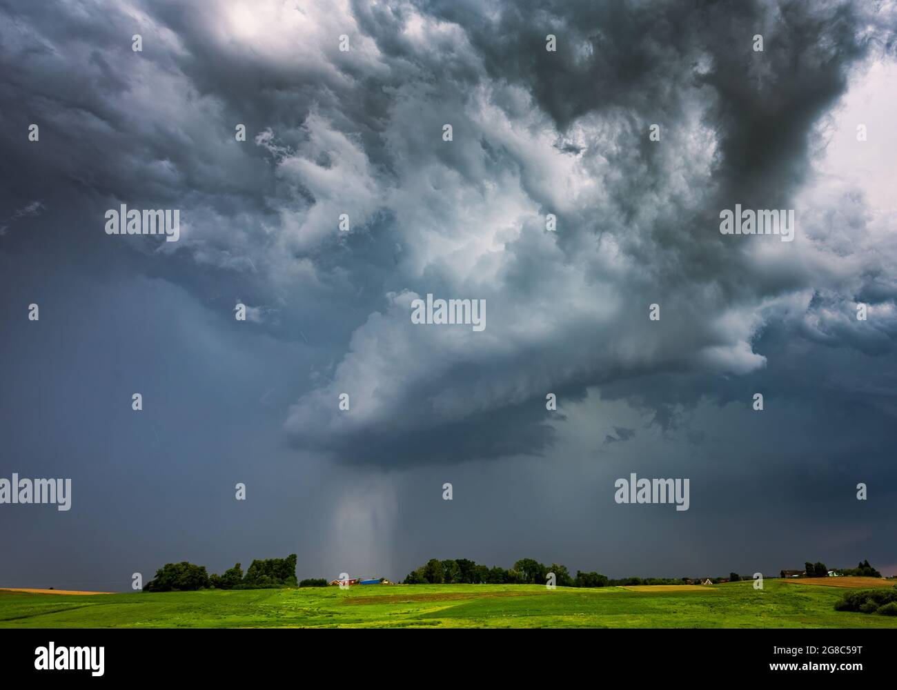 Extreme thunderstorm supercell with white hail core, hail falling on a ...