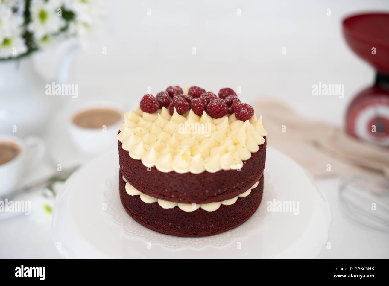 Red velvet cake with cream cheese topping Stock Photo - Alamy