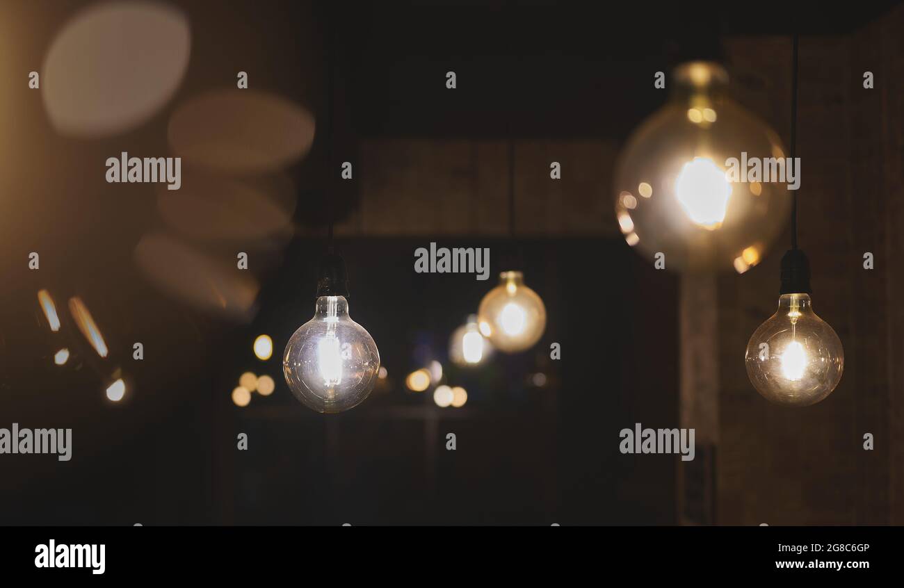 detail of retro style led light bulbs in the shape of a sphere hanging ...