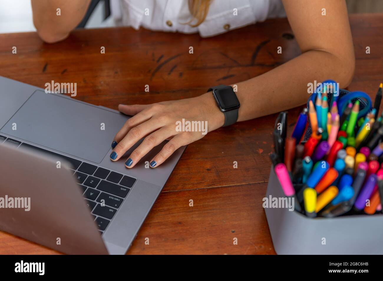 Female student hand up desk hi-res stock photography and images - Alamy