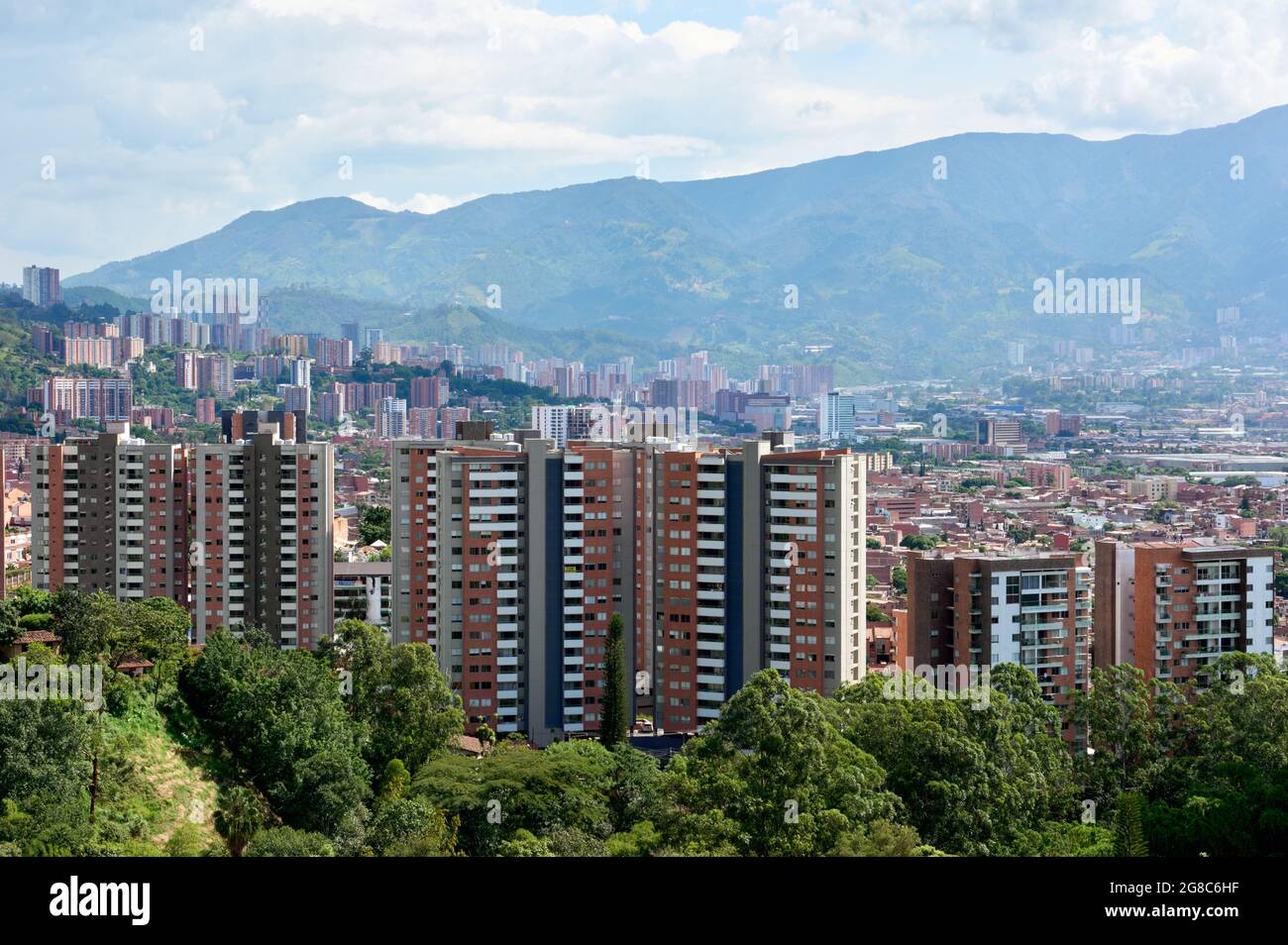 Beautiful shot of Medellin city surrounded by greenery-covered ...