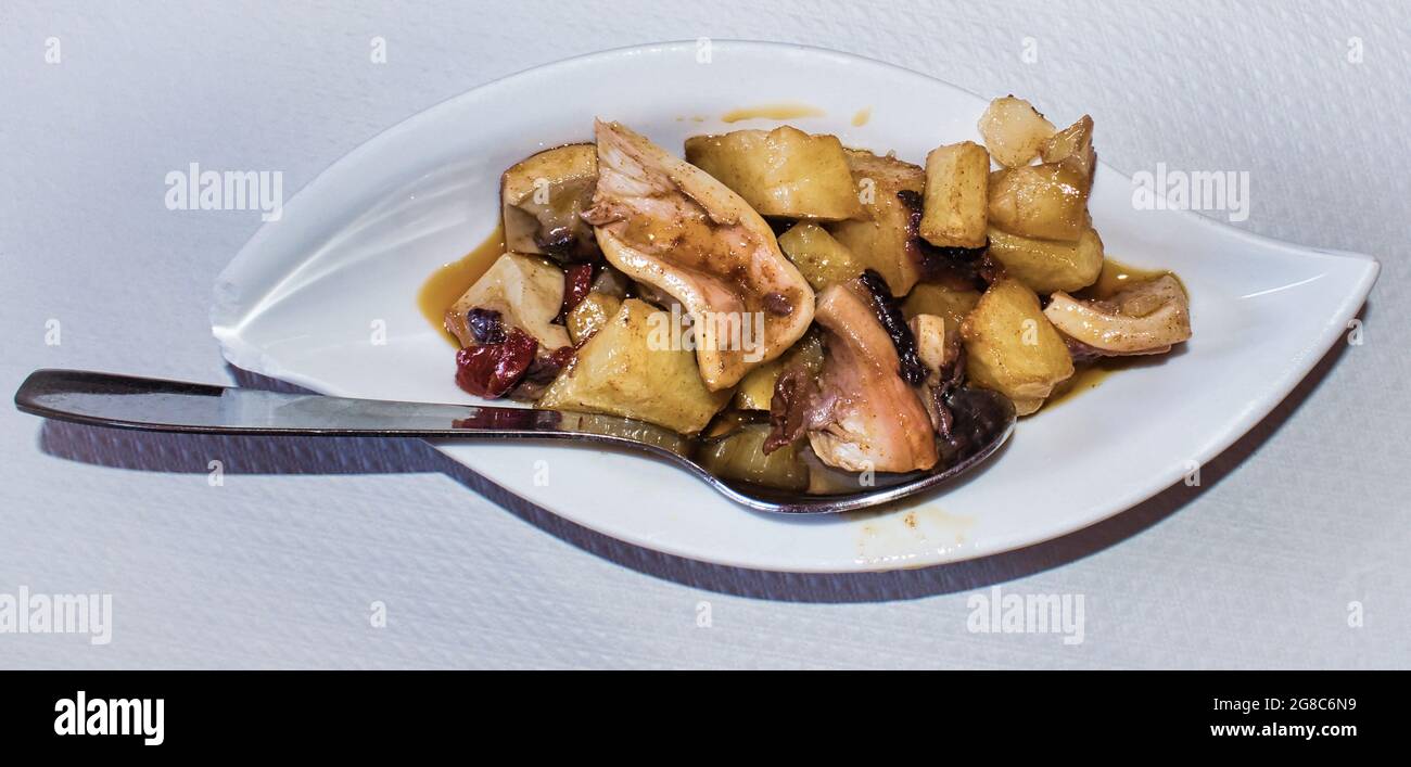 Traditional Galician dish from potato stew and squid Stock Photo - Alamy