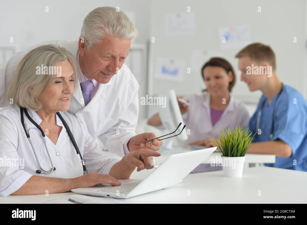 Portrait of a senior doctors at hospital Stock Photo - Alamy