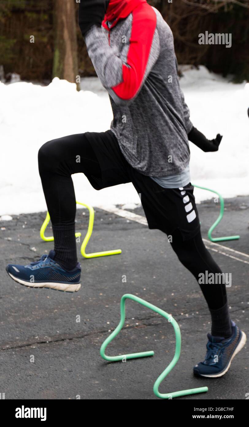 Track and field practice moved to a parking lot because of a snow storm ...