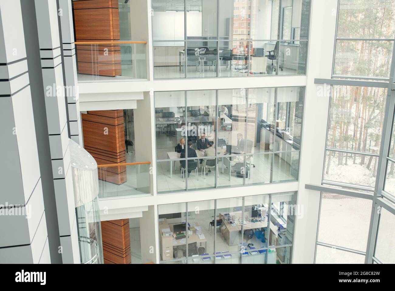 Image of modern office building with big windows and business people ...