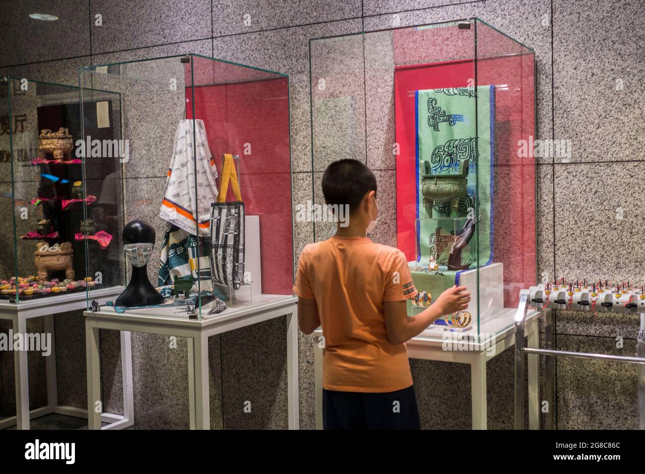 A person observes a Bronze Tripod, one of the Chinese cultural relics ...