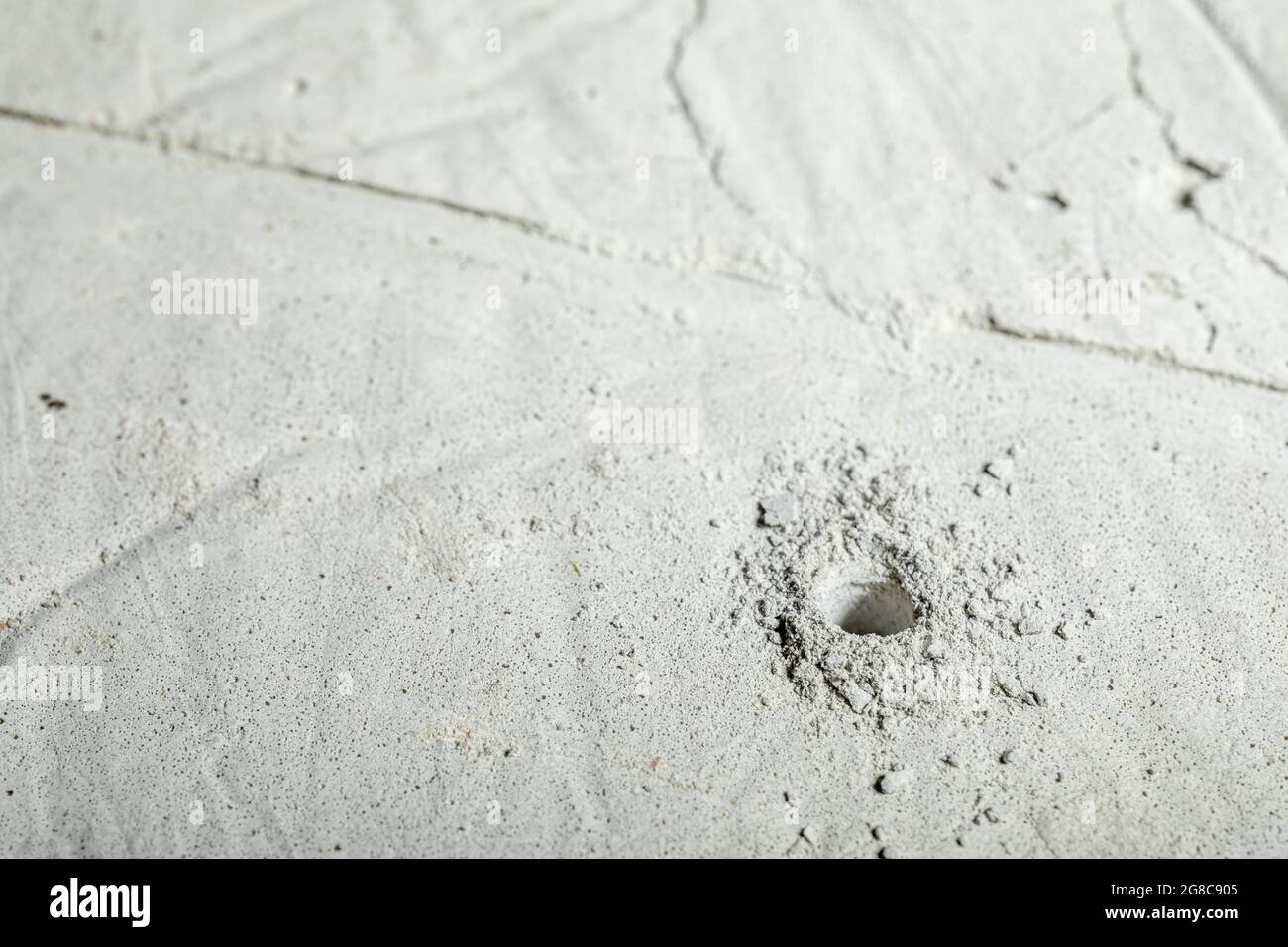 Drilled hole in concrete for a dowel close-up Stock Photo - Alamy