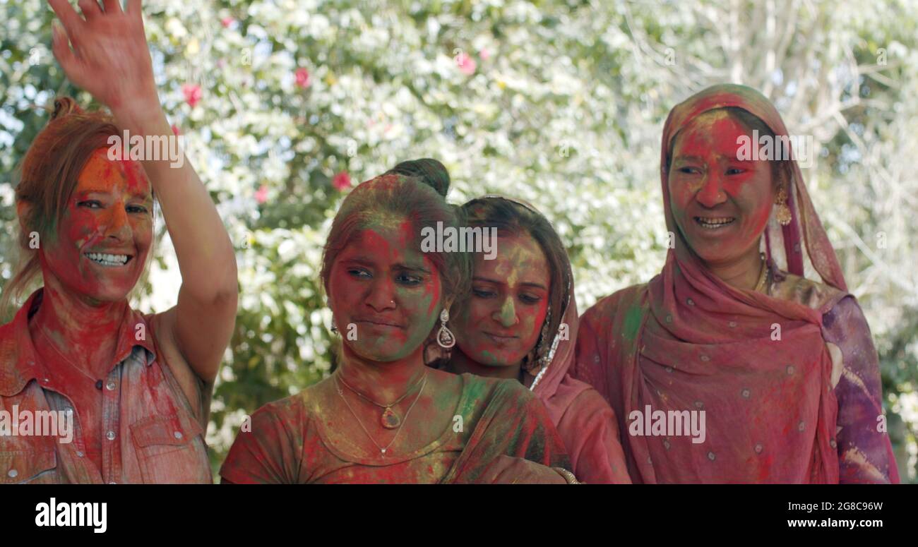 Women covered in colorful paint are enjoying the Holi festival Stock ...