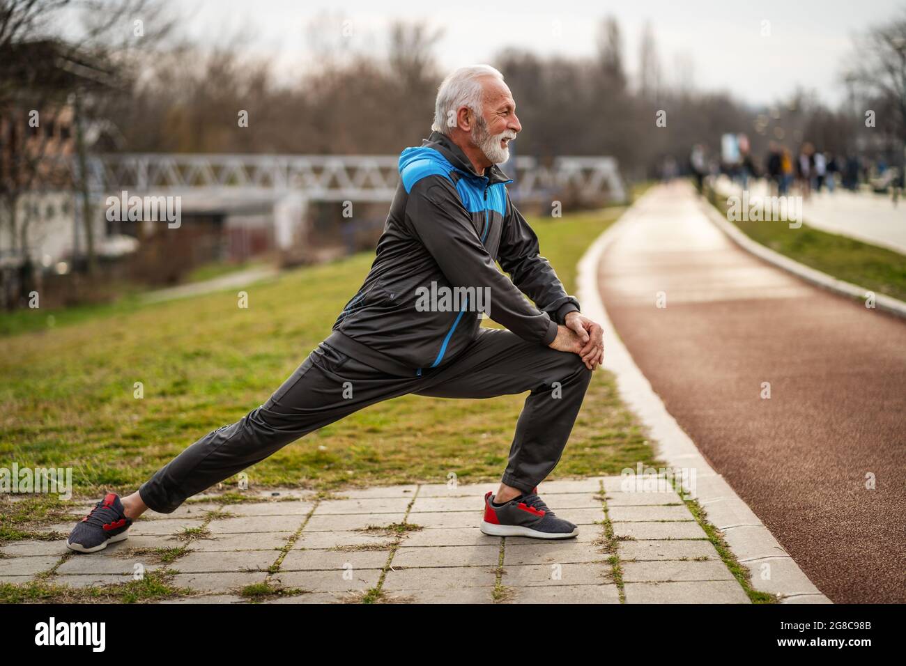 Handsome senior man stretching hi-res stock photography and images - Alamy