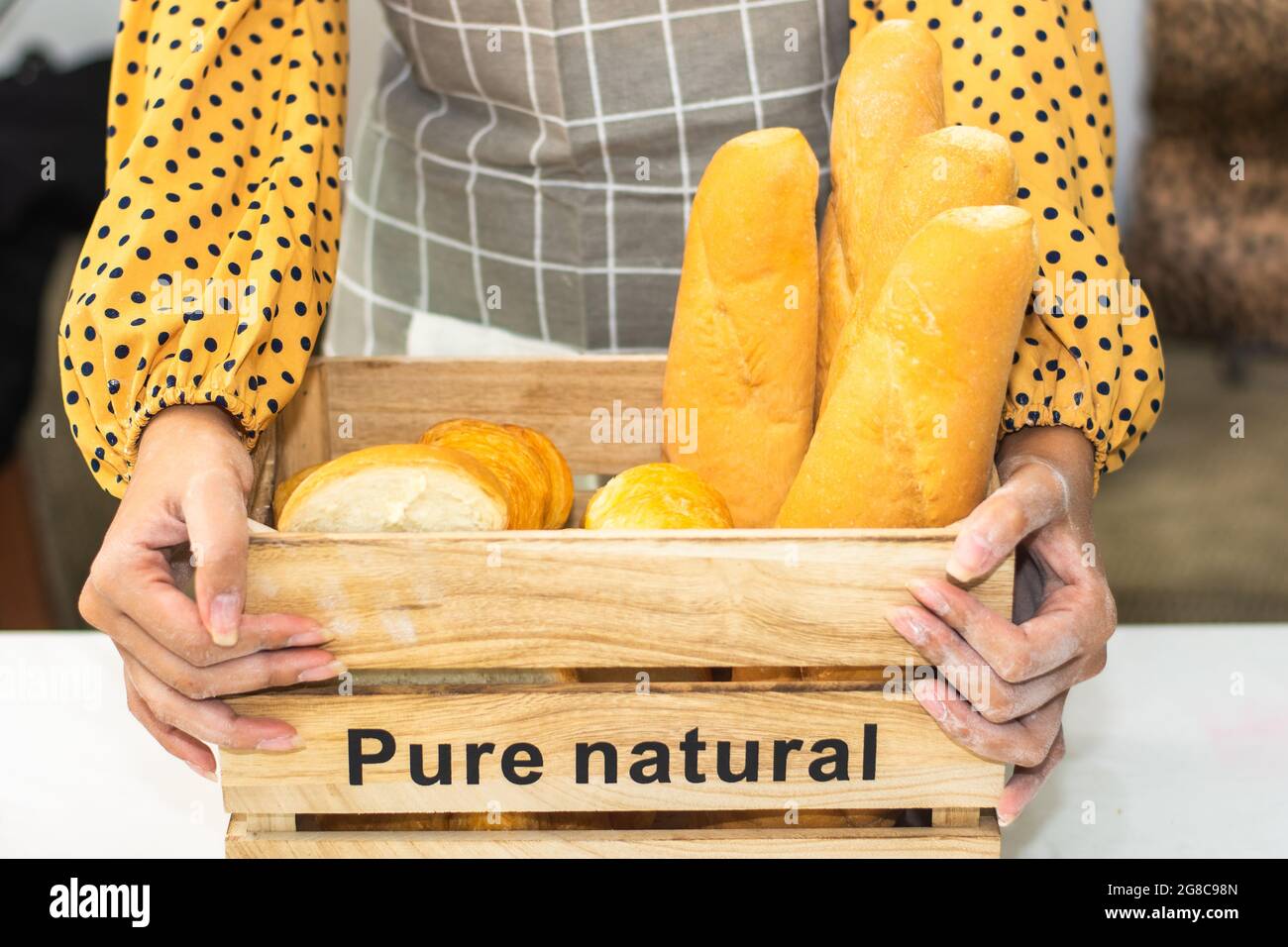 Hand holding Bucket bread fresh in bread shop Stock Photo - Alamy