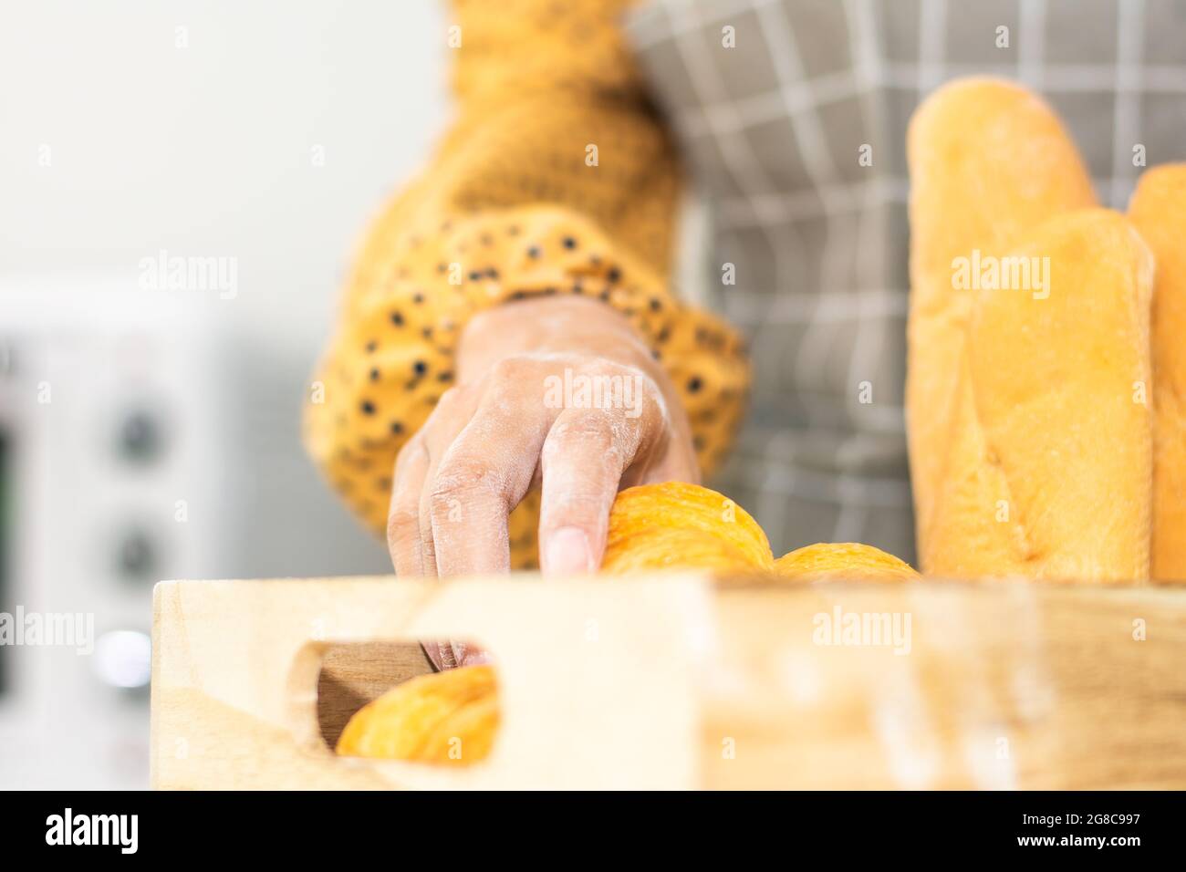 Hand holding Bucket bread fresh in bread shop Stock Photo - Alamy