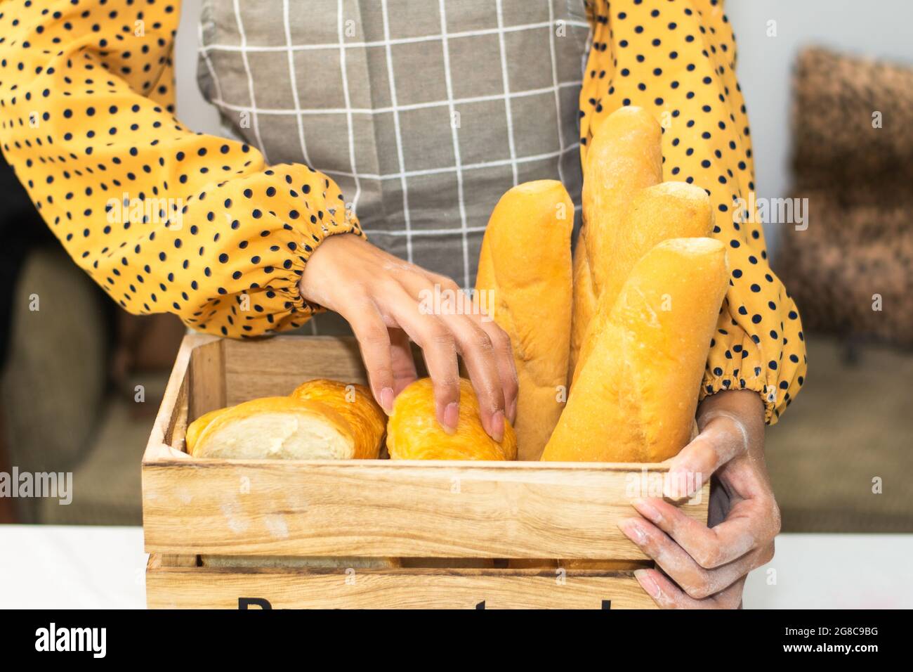 Hand holding Bucket bread fresh in bread shop Stock Photo - Alamy