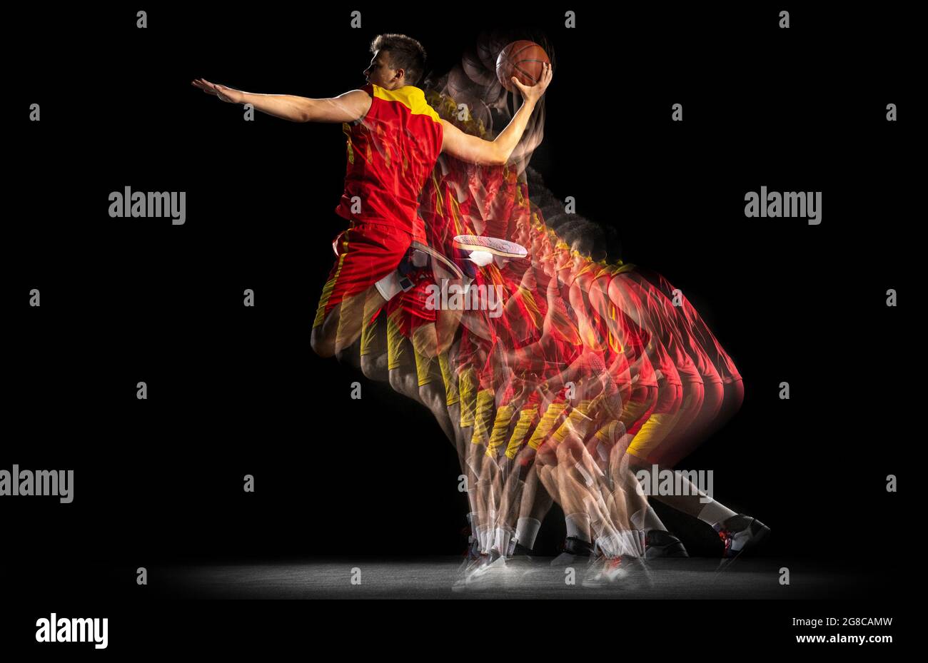 Power and speed. One young basketball player training with ball ...