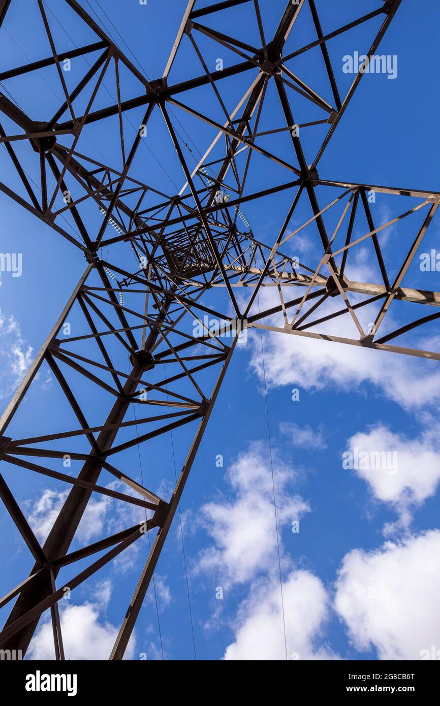 Power line towers against the blue sky. Wide viewing angle on the power ...
