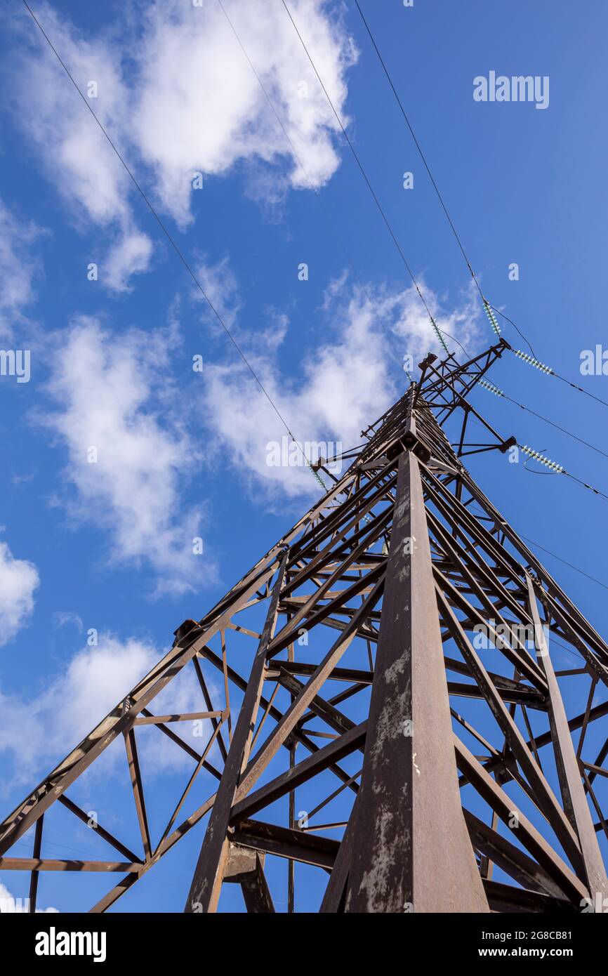 Power line towers against the blue sky. Wide viewing angle on the power ...