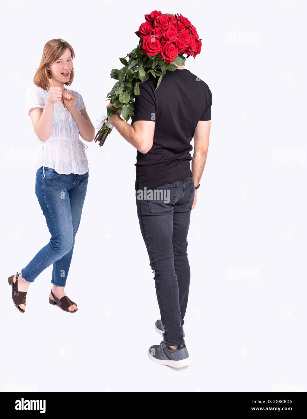 The handsome girl is glad to see her boyfriend carrying a beautiful ...