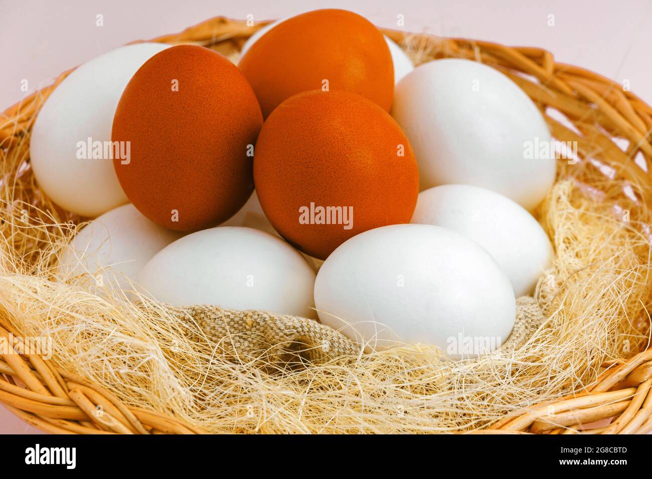 This is a rustic wicker basket with natural white and brown chicken ...