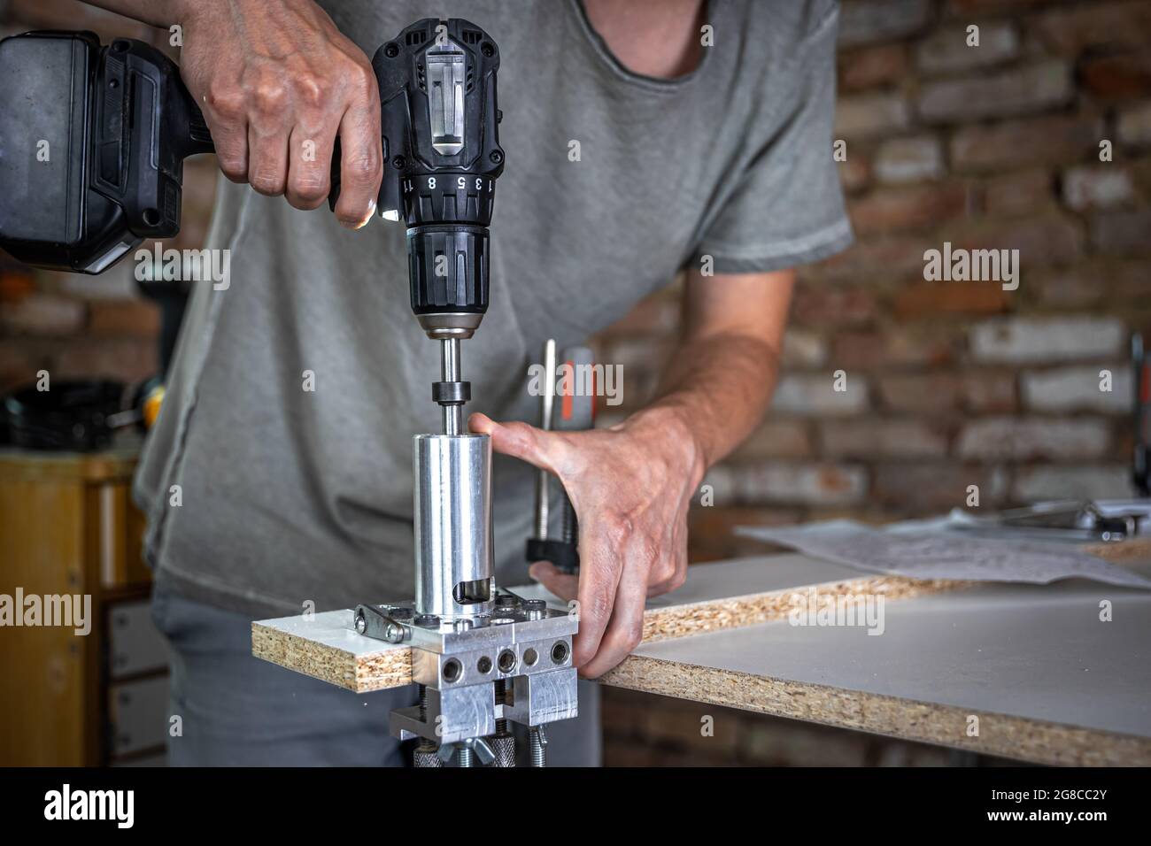 Professional carpenter working with wood and building tools in house ...