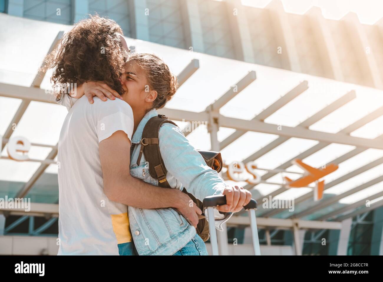 Couple plane hugging hi-res stock photography and images - Alamy