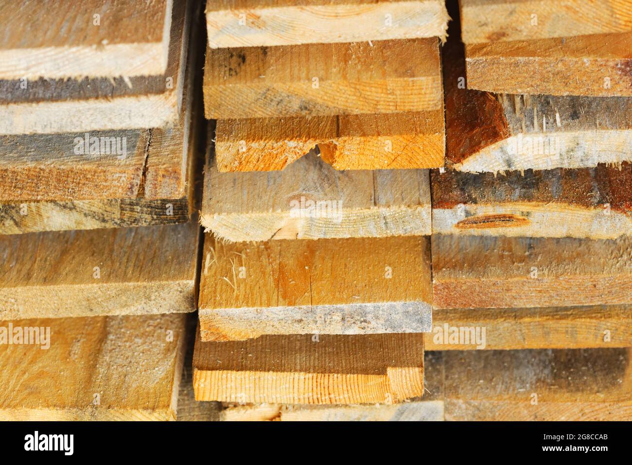 Boards and construction lumber lie in the carpentry workshop ...