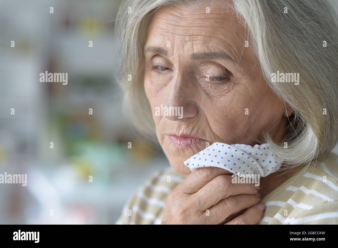 Portrait of a sad sick senior woman Stock Photo - Alamy