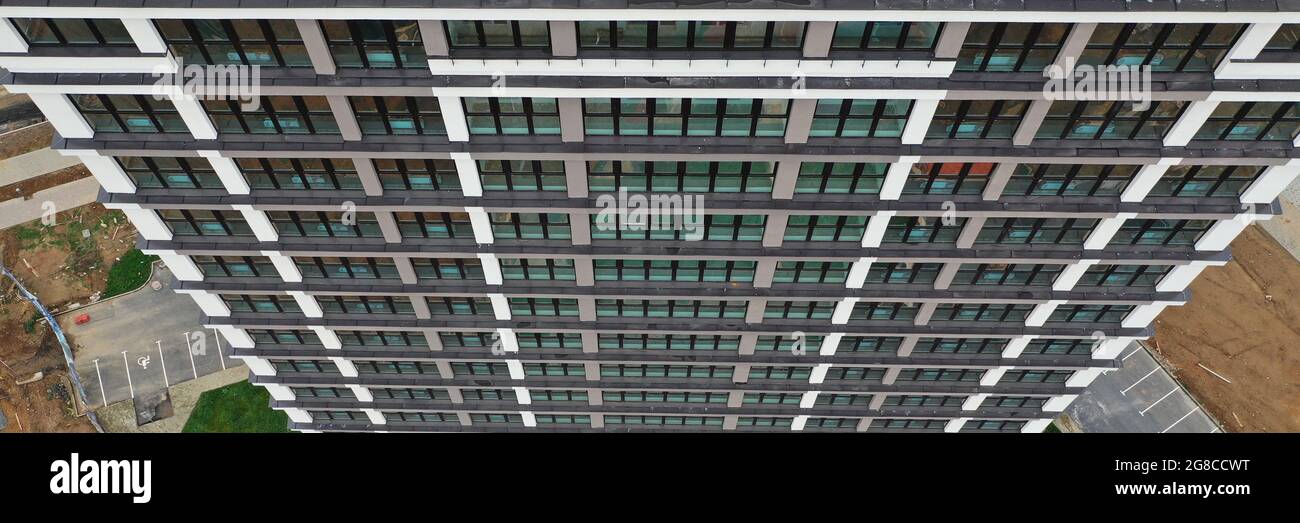 Beautiful multi-storey building standing on construction site top view ...