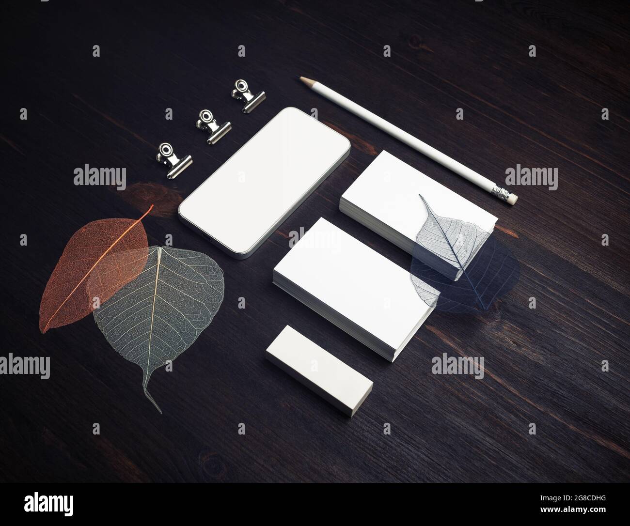 Brand ID template. Blank business cards, smartphone, pencil, eraser and ...