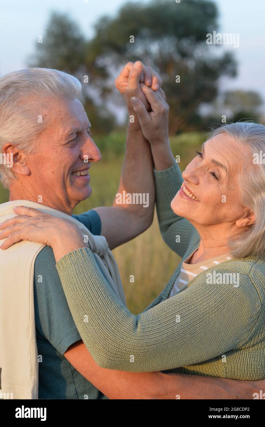Senior couple dancing in park hi-res stock photography and images - Alamy