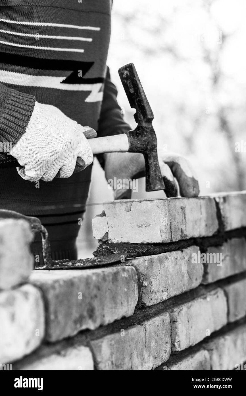 Man holding black orange Black and White Stock Photos & Images - Alamy