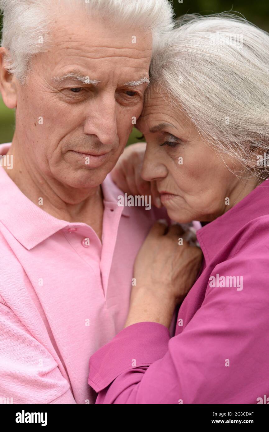 Sad couple hug park hi-res stock photography and images - Alamy