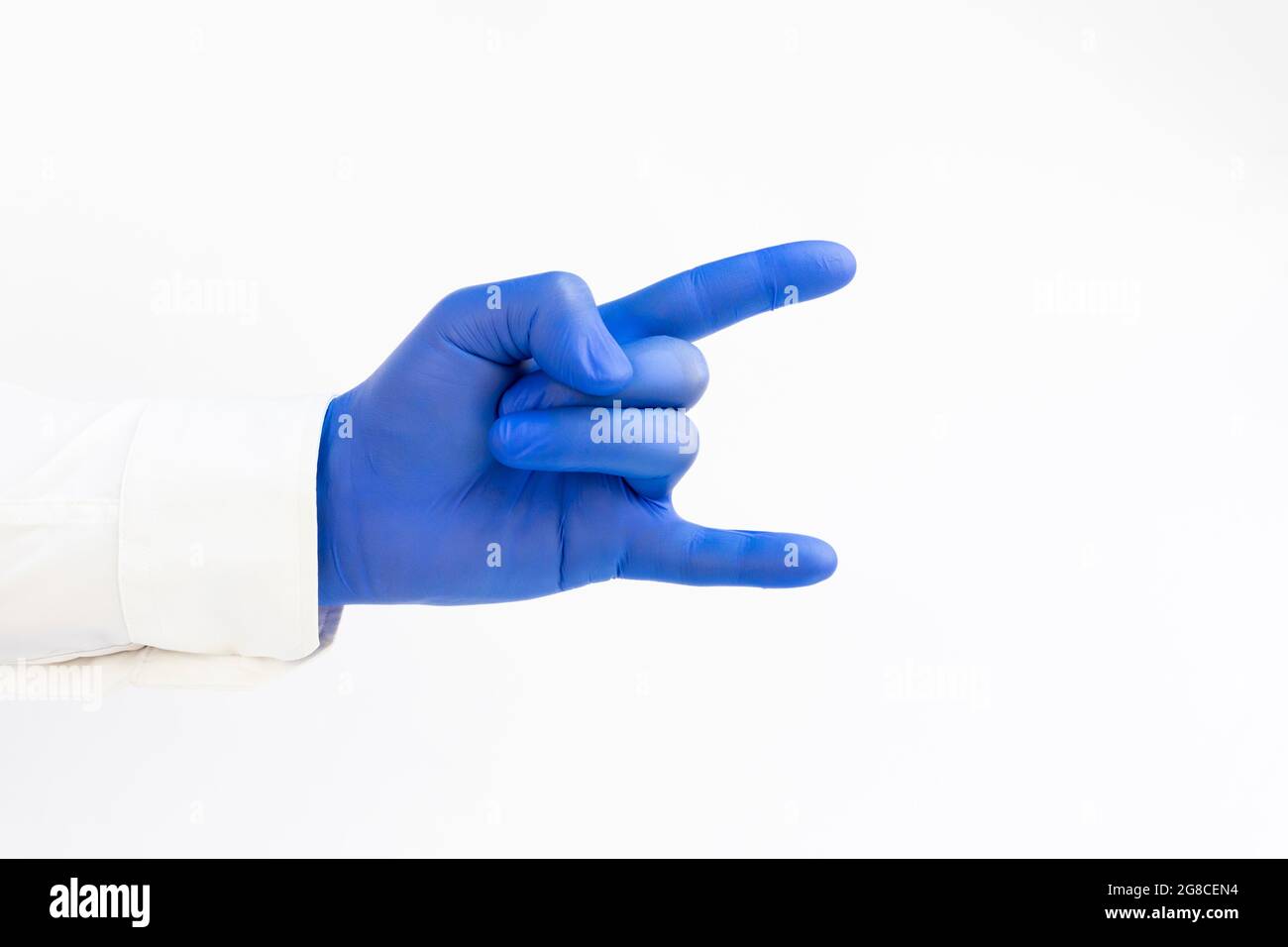 Hand in blue latex Glove giving Devil sign. Heavy metal Stock Photo - Alamy