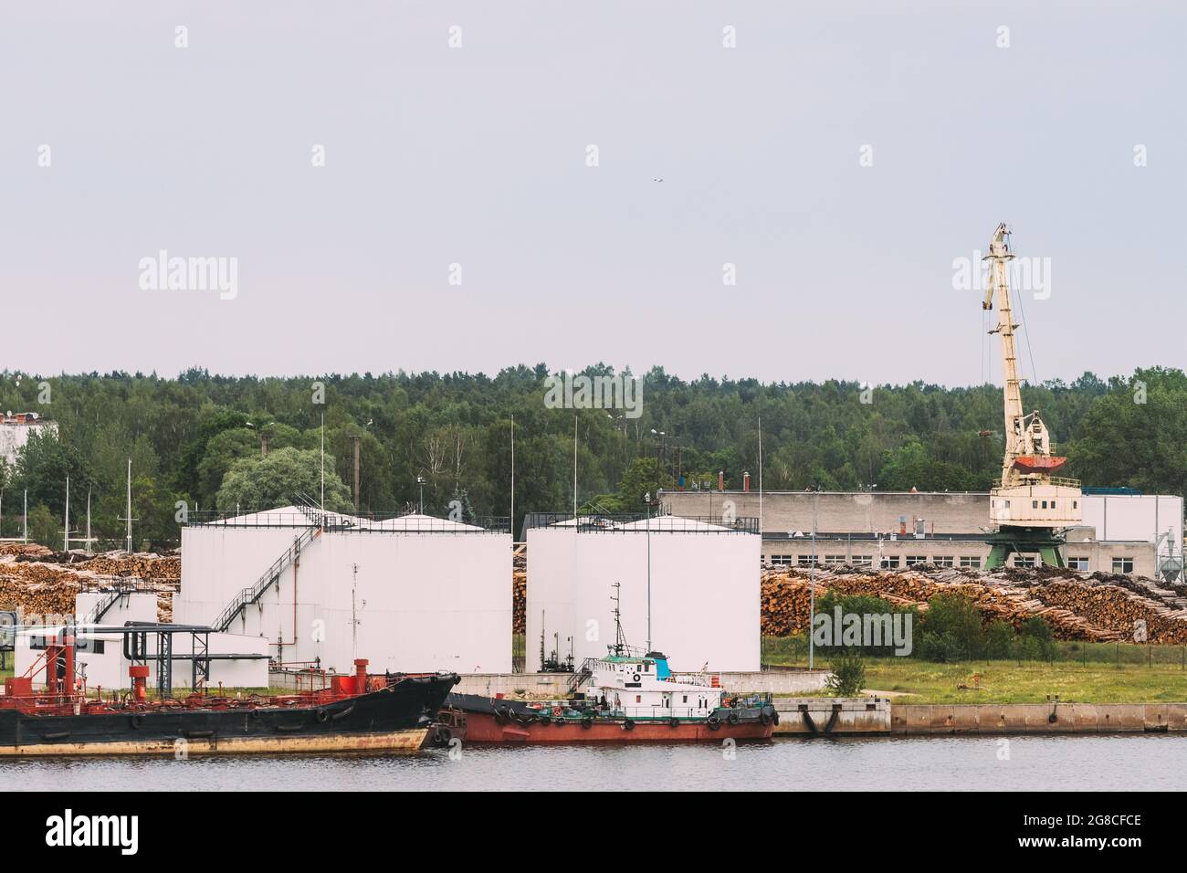Tanks Oil Refinery In Port. Industrial Port Terminal Stock Photo - Alamy