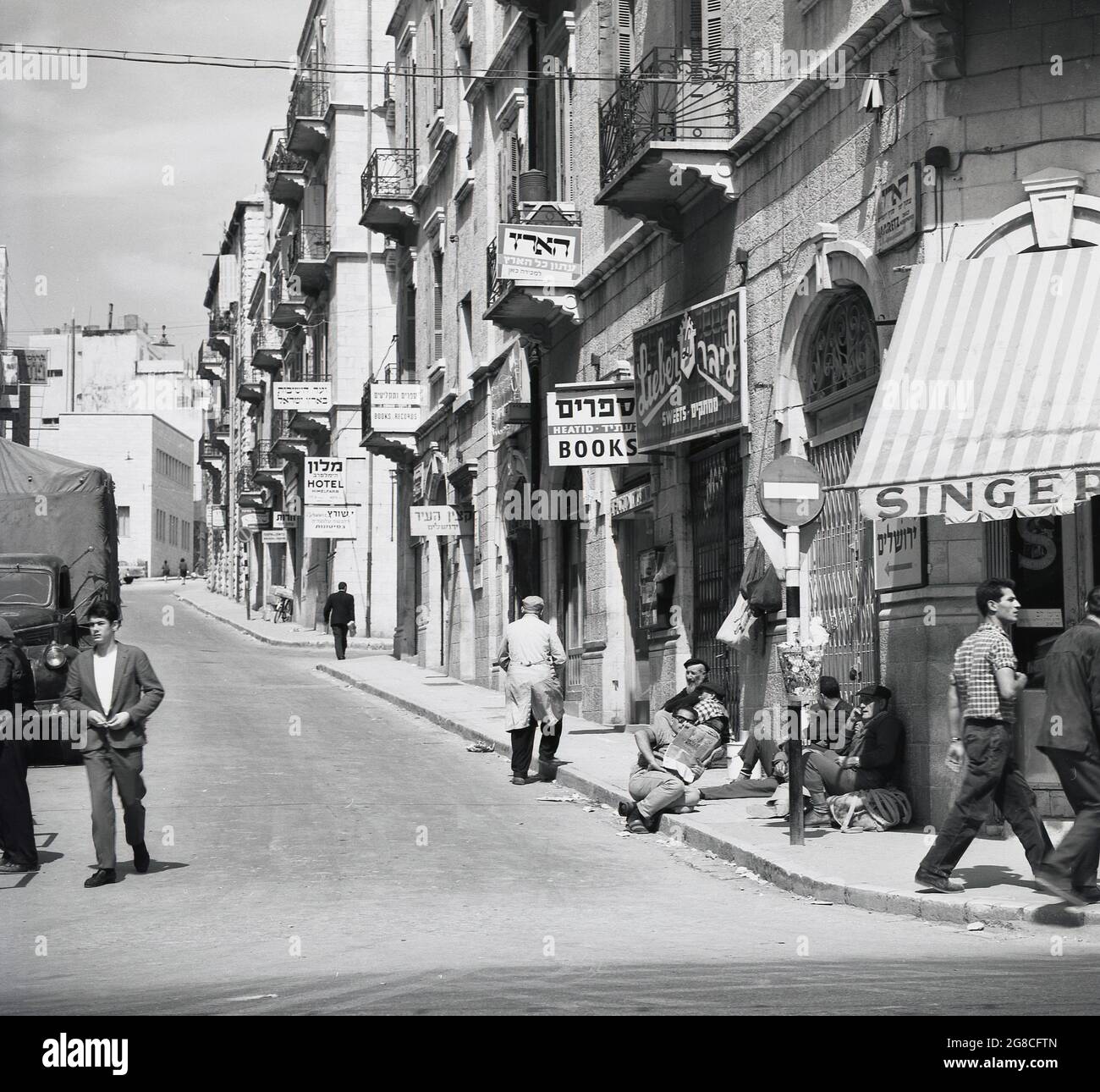 1960s, historical, street corner, Jerusalem, Israel, local men sitting ...