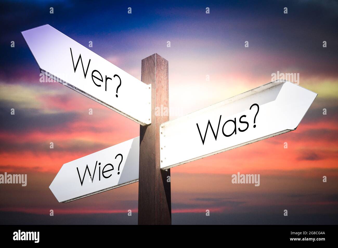 Wer? Was? Wie? (German)/ Who? What? How? (English) - signpost with ...