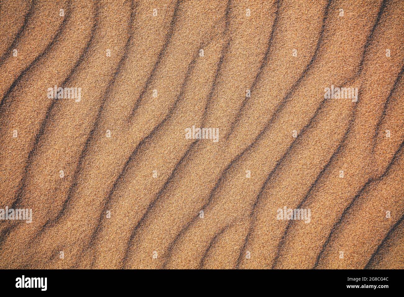 Abstract wavy sandy background. Beach sand texture Stock Photo - Alamy