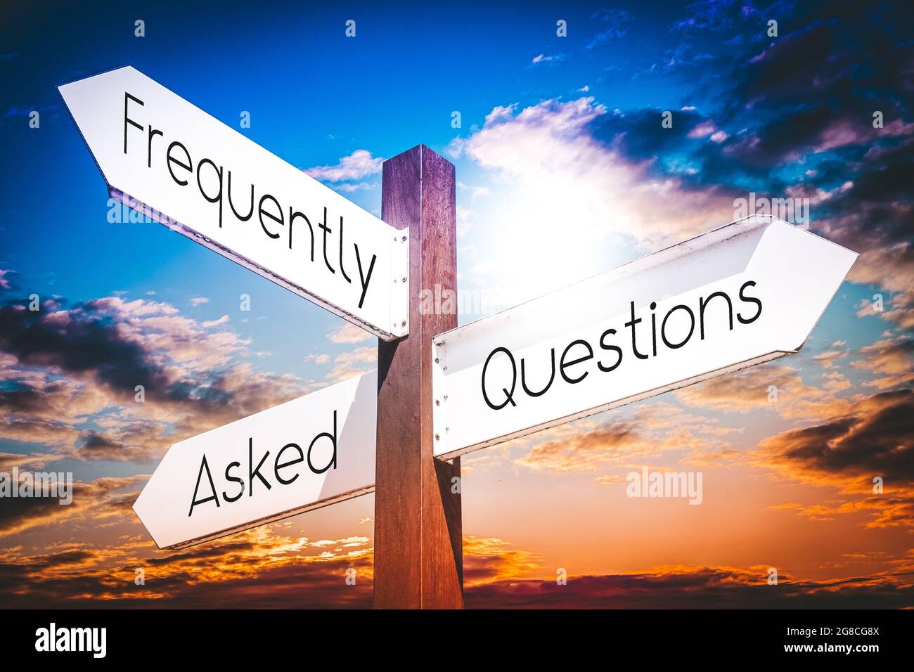 Frequently asked questions - signpost with three arrows Stock Photo - Alamy