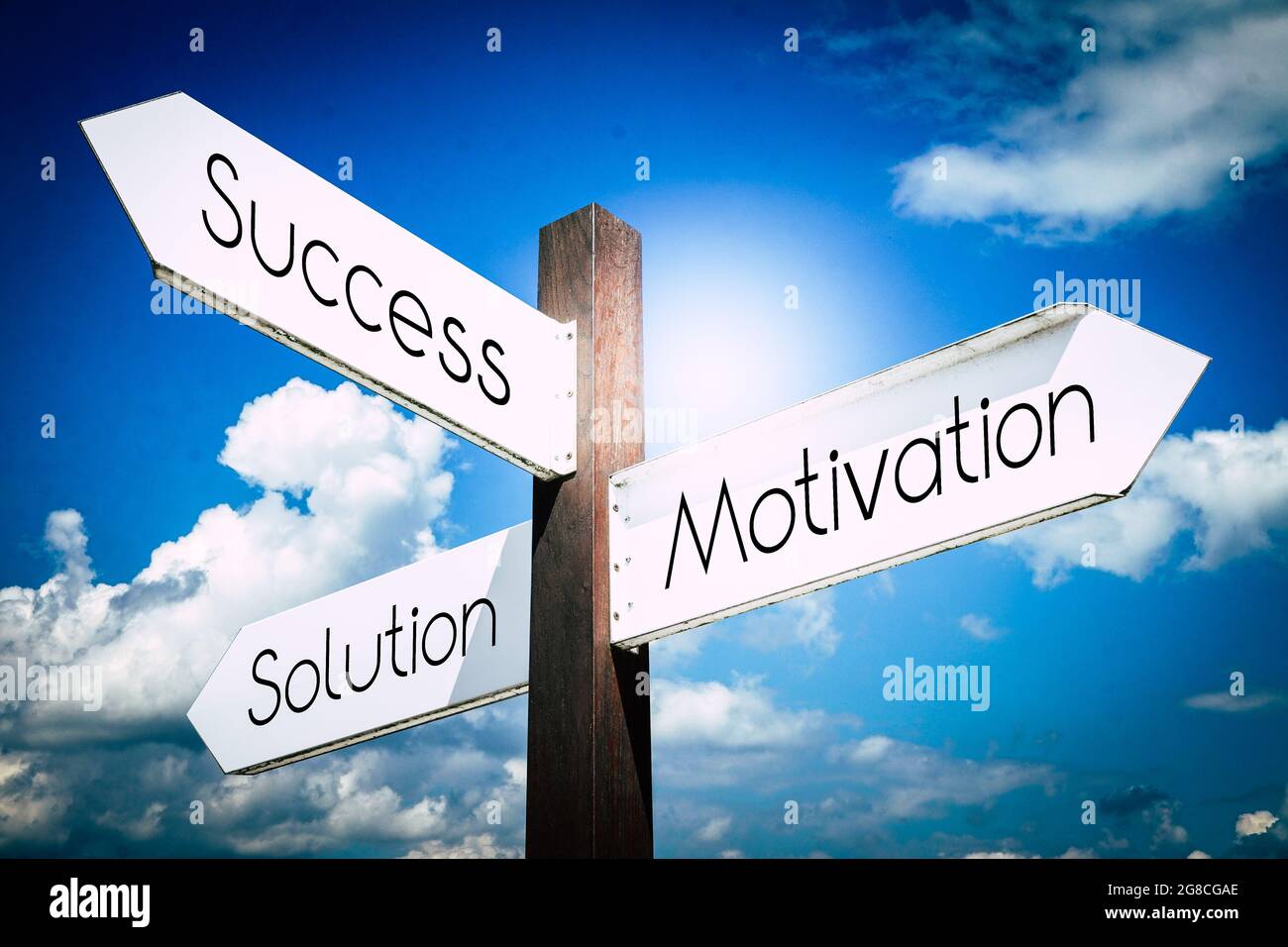 Success, motivation, solution concept - signpost with three arrows ...