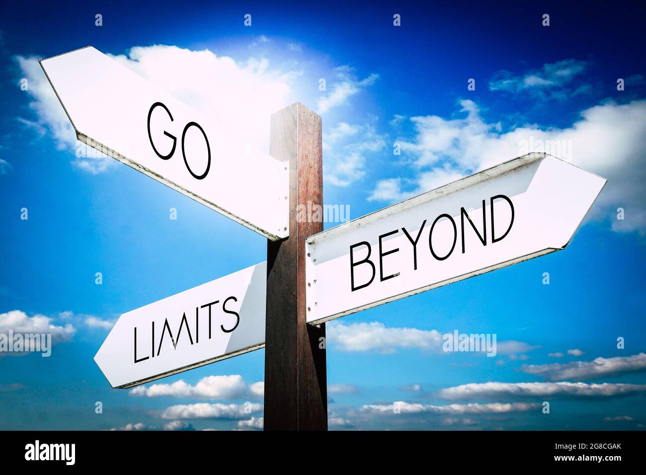 Go beyond limits concept - signpost with three arrows Stock Photo - Alamy Go beyond limits concept - signpost with three arrows Stock Photo - Alamy