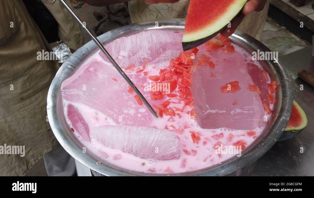 Top view of Iranian ice drink sharbat prepared with flower petals or ...