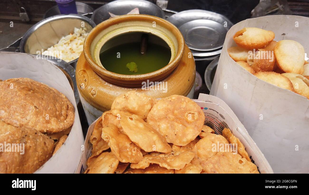Indian spicy street food Panipuri or fuchka - hollow puris filled with ...